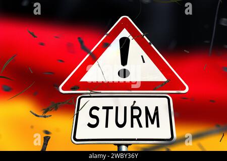 12 January 2024: Storm warning sign in front of Germany country flag ...