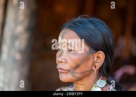 Portrait of a Ollo Nocte old woman with facial tattooes, Lazu village ...