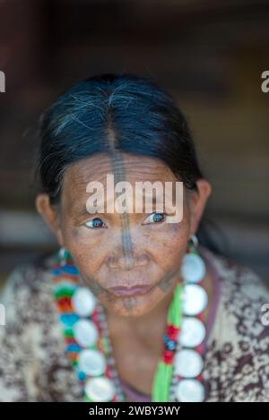 Portrait of a Ollo Nocte old woman with facial tattooes, Lazu village ...