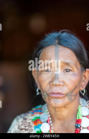 Portrait of a Ollo Nocte old woman with facial tattooes, Lazu village ...