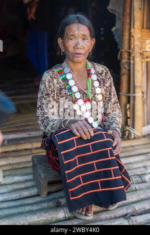 Seated Ollo Nocte woman with facial tattooes, Lazu Village, Arunachal ...