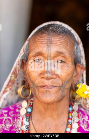 Portrait of a Ollo Nocte old woman with facial tattooes, Lazu village ...