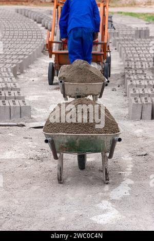 Construction site. Small cement factory, Truck crane and other ...