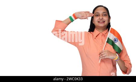 A young Indian girl salutes to national flag, holding the national flag ...