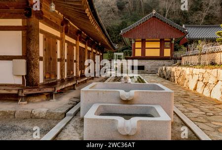 Concrete water cistern with turtle fountain at Buddhist temple Stock ...