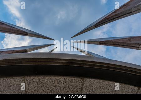 Curved, pointed spires of building reaching into beautiful partly ...