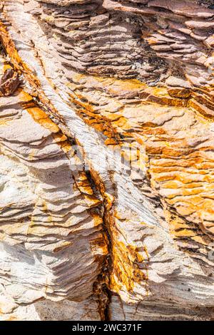 Coloured, ferruginous mineral sandstone on Topinetti beach, near Rio ...
