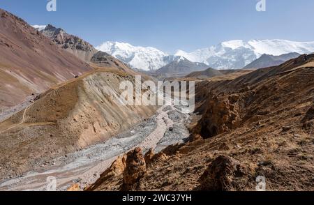 Achik Tash river, Achik Tash valley with rock formations, behind ...