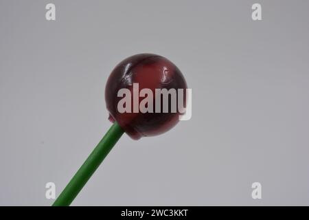 Bright natural sucking candies, lollipops on sticks in colored ...