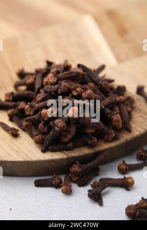 Pile of aromatic cloves on light table, closeup Stock Photo - Alamy