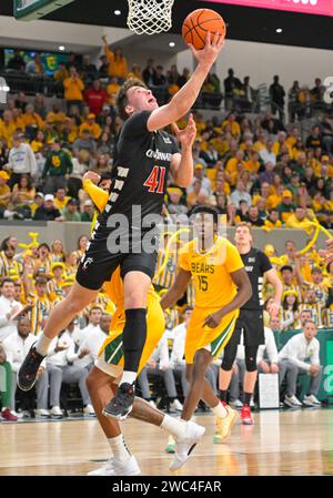 Cincinnati guard Simas Lukosius (41) dribbles against Dayton guard ...