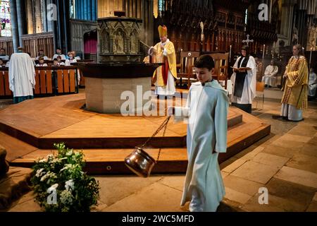 The Right Revd Stephen Lake, Bishop of Salisbury, rubs oil as he ...