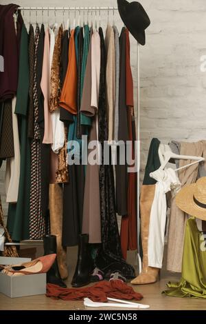 Untidy cluttered woman wardrobe with stylish clothes and accessories ...