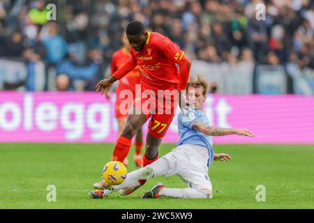 Lecce’s French midfielder Mohamed Kaba challenges for the ball with Lazio’s Italian midfielder ...
