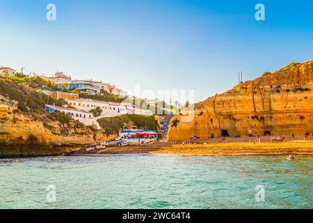 Beautiful limestone cliff Algarve coast with village of Benagil, south ...