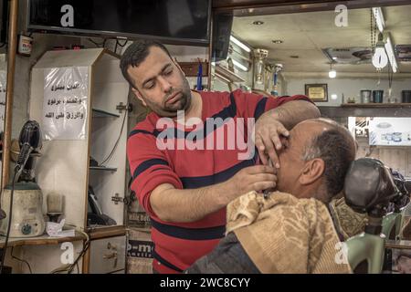 Arab man with beard working at small business ecommerce holding bitcoin ...