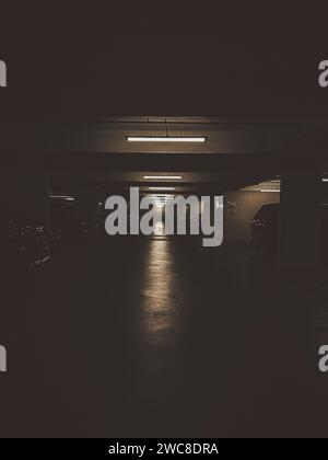 Dimly lit empty parking garage, Parking lot with empty places Stock ...