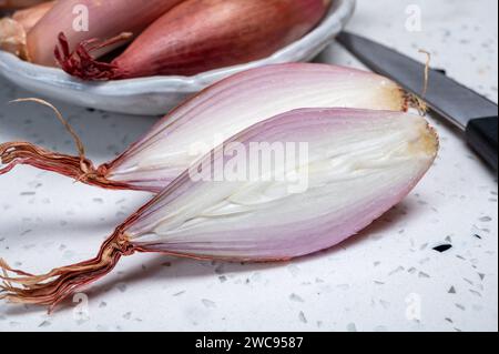 French long pink shallots grappe onion from Brittany, France in garden ...