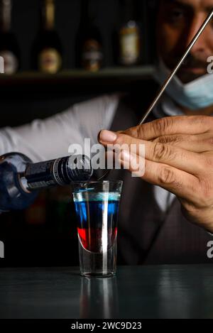 multi-layered cocktail shots at the bar Stock Photo - Alamy