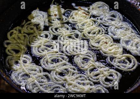 indian traditional sweet jalebi deep frying at hot refined oil Stock ...