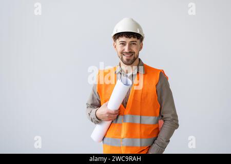 Portait of engineer with white hat blueprint isolated on white ...