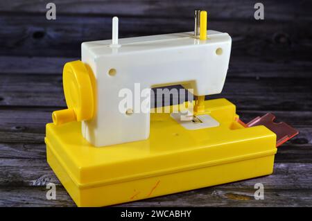 plastic toy for a swing machine to teach children how to sew fabric ...
