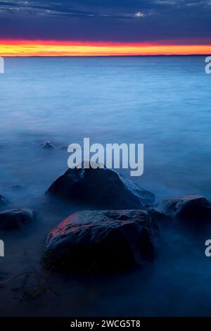Chequamegon Bay on Lake Superior shoreline rocks at sunrise, Memorial ...