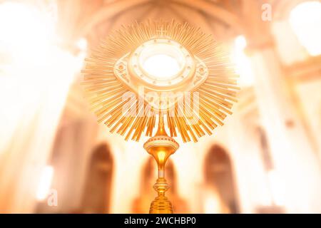 A monstrance containing the consecrated host being displayed in a ...