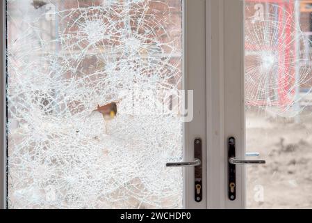 Broken window in new build house Stock Photo - Alamy