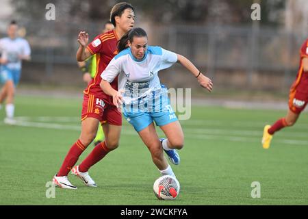 Alice Corelli of AS Roma competes for the ball with Megan Connolly of ...