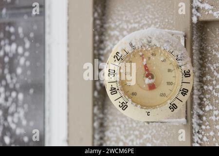 Snow Capped Thermometer Mounted on Wooden Siding of House Showing ...