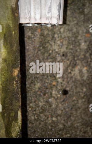 Water Droplets Dripping from Storm Drain Stock Photo - Alamy