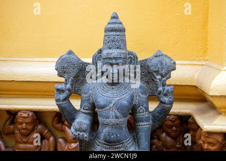 Ancient statues at the entrance of Gangaramaya Temple, it is one of the ...