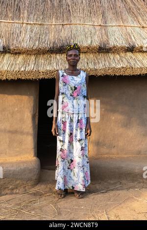 Uganda, Adjumani. A woman in a refugee camp poses for a portrait ...
