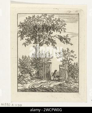 Man with wheelbarrow walking through fence Stock Photo - Alamy