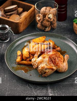 Portion of gherkin chicken with potatoes Stock Photo - Alamy