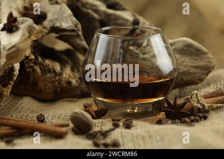 Glass of cognac with spice. Cloth background with copy space Stock ...