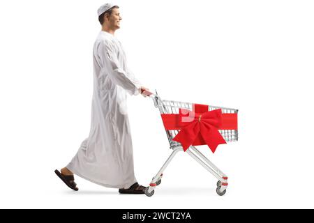 Muslim man walking and pushing a shopping cart full of presents ...