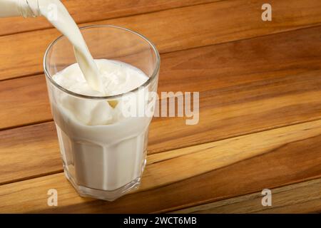 Filling glass of milk. Fresh milk Stock Photo - Alamy