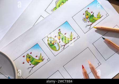 Storyboards with cartoon sketches at workplace, flat lay. Pre ...