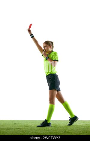 Serious woman, soccer referee gesturing, raising hand, stopping game ...
