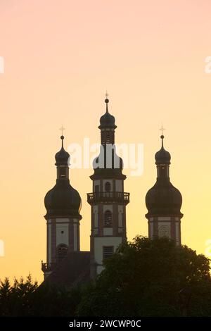 Modern bell tower with a tree at sunset Stock Photo - Alamy
