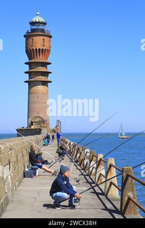 France, Nord, Dunkirk, west pier of the port, dunes and the fire of ...