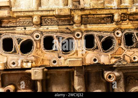 A photo showing dirty intake manifolds in a car engine, impacted by ...