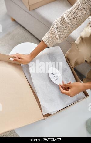 african american woman opening parcel box at home Stock Photo - Alamy