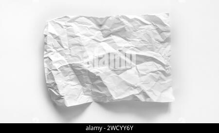 A heavily crumpled sheet of white paper close-up with copy space ...