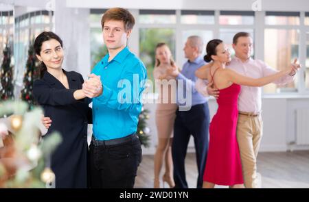Couples dancing during Christmas - men and women dancing tango or samba ...