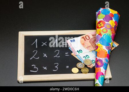 school cone, slate and money, symbolic image for school fees Stock ...