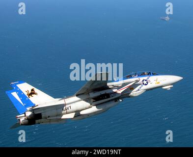 US Navy An F-14D Tomcat banks with its tailhook lowered in preparation ...