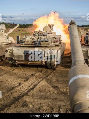 A rear view of an M1 Abrams main battle tank being secured for railroad ...